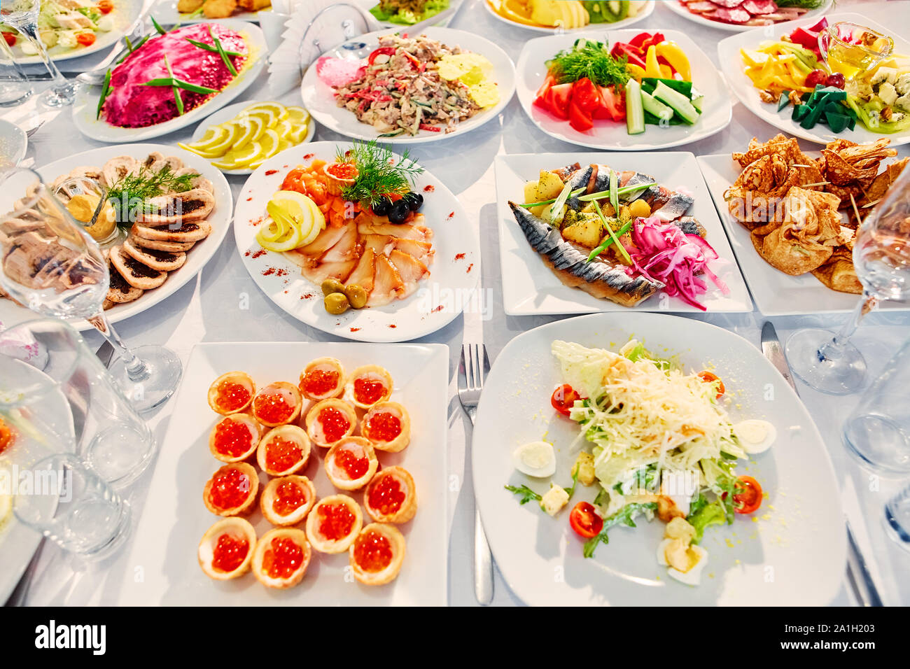 Beautifully decorated catering banquet table with different food snacks ...