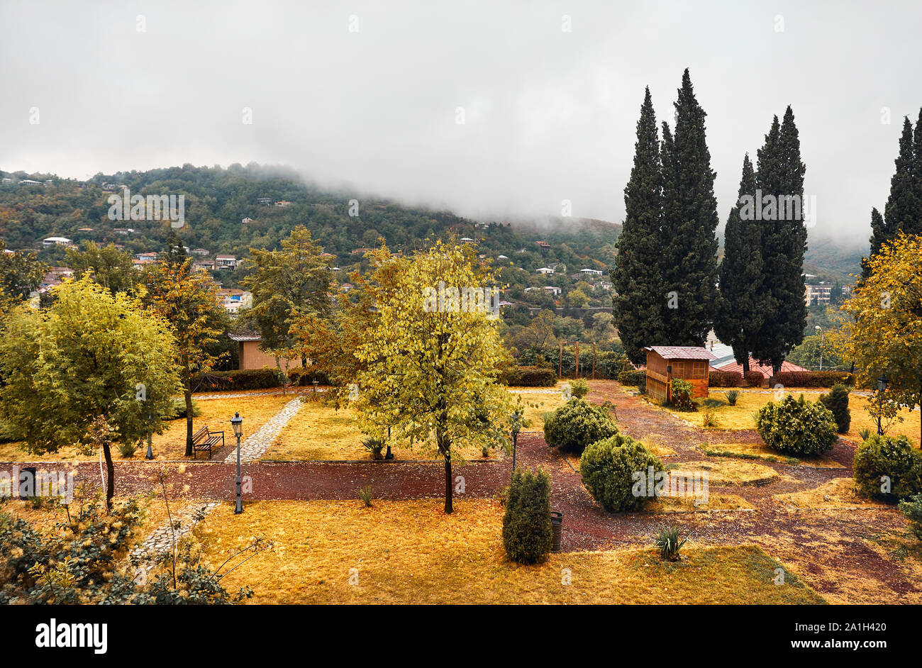 Autumn Park with bench at foggy mountain background at Signagi town in ...