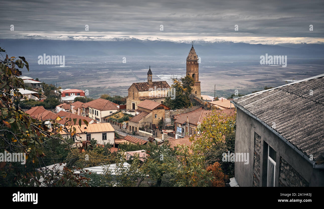 Old Church with tower in Signagi town at Alazani valley with mountains ...