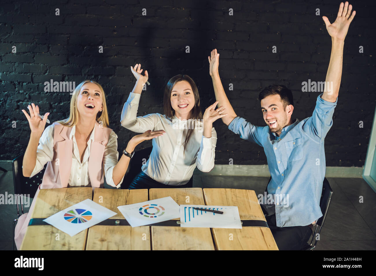 Young team of coworkers making great meeting discussion in modern ...