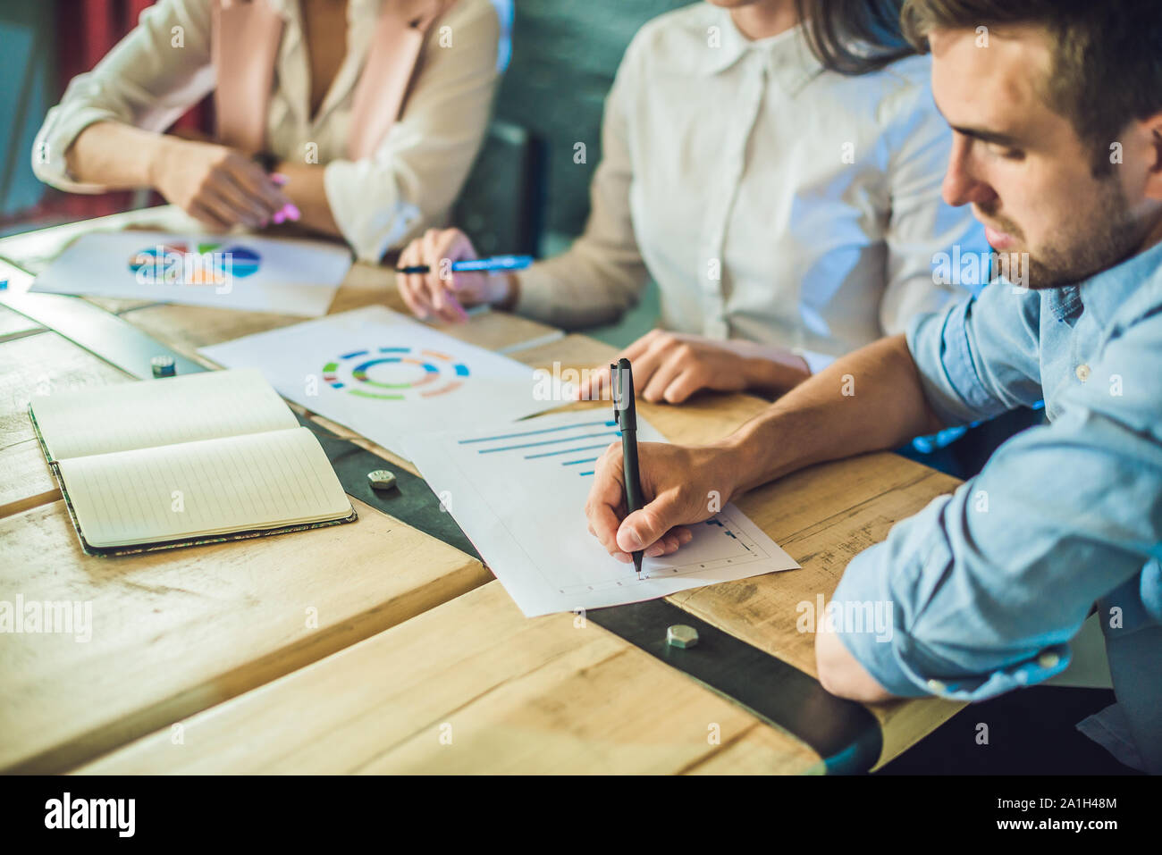 Young team of coworkers making great meeting discussion in modern ...