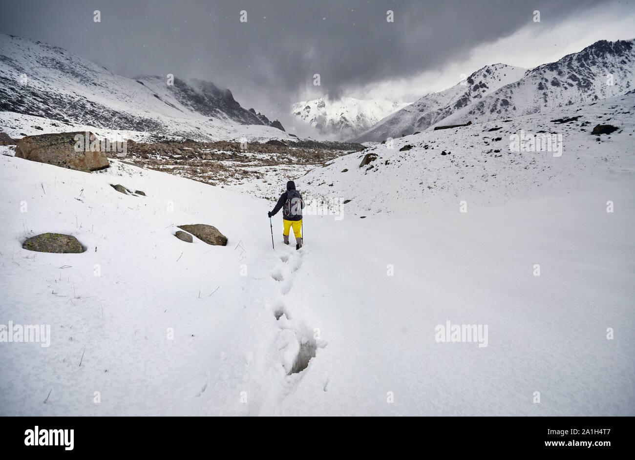 Tourist in the snow path at beautiful overcast sky background. Outdoor ...