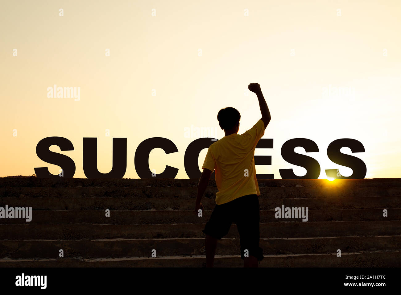 Young man stepping up the concrete stairs, Ambitions concept and ...