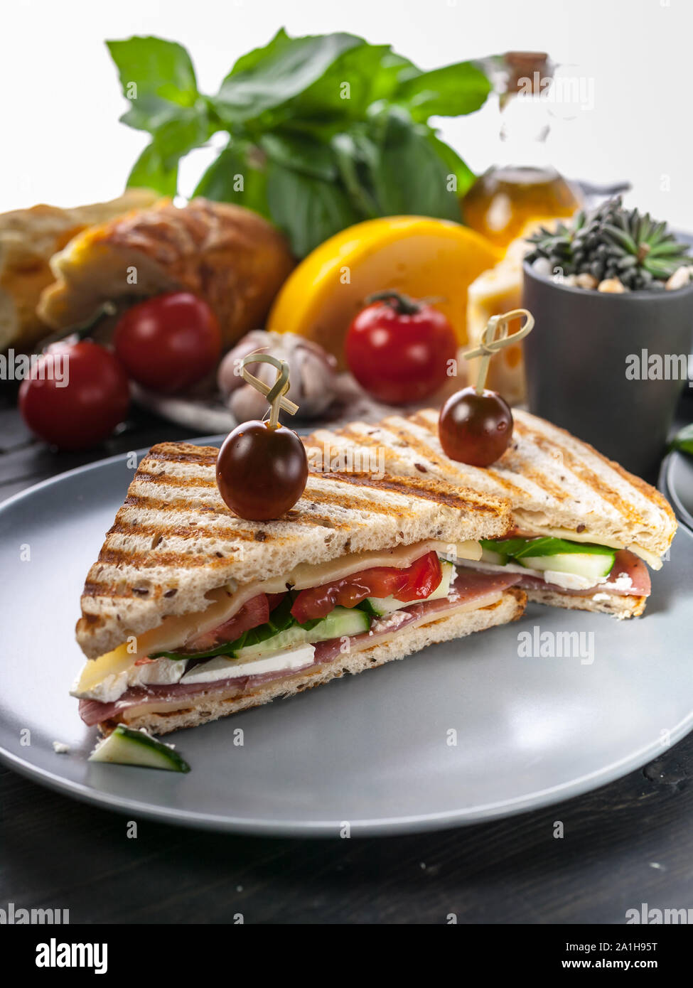 Vertical shot canapes for breakfast on black plate. Bread pieces with ...