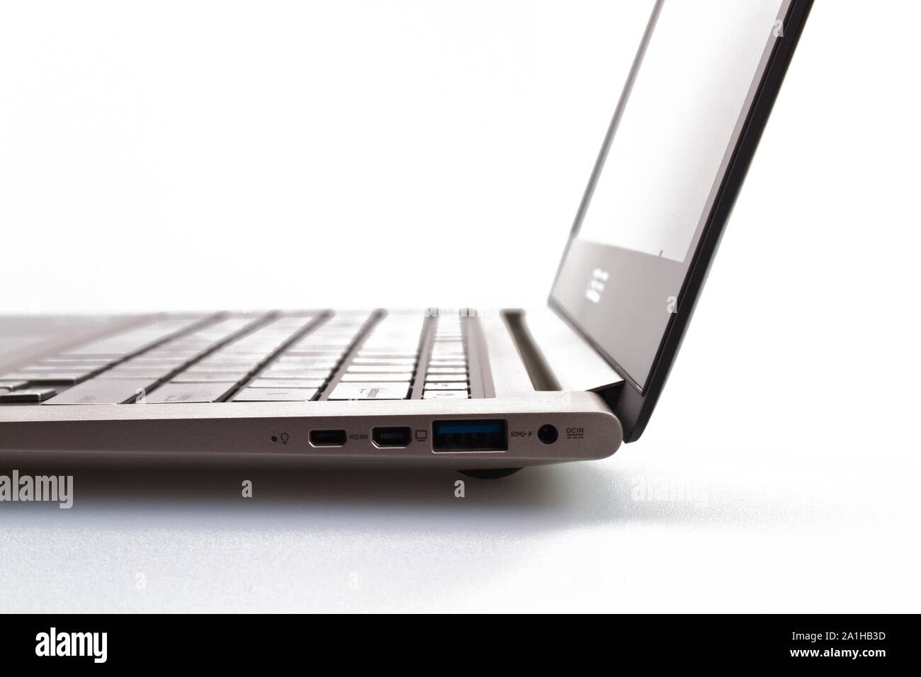 a modern metal laptop with opened lid on white background for abstract ...