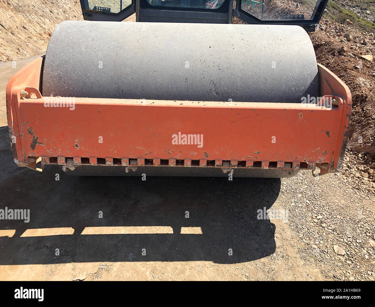 Vibrating roller compresses the soil of a road surface during road ...