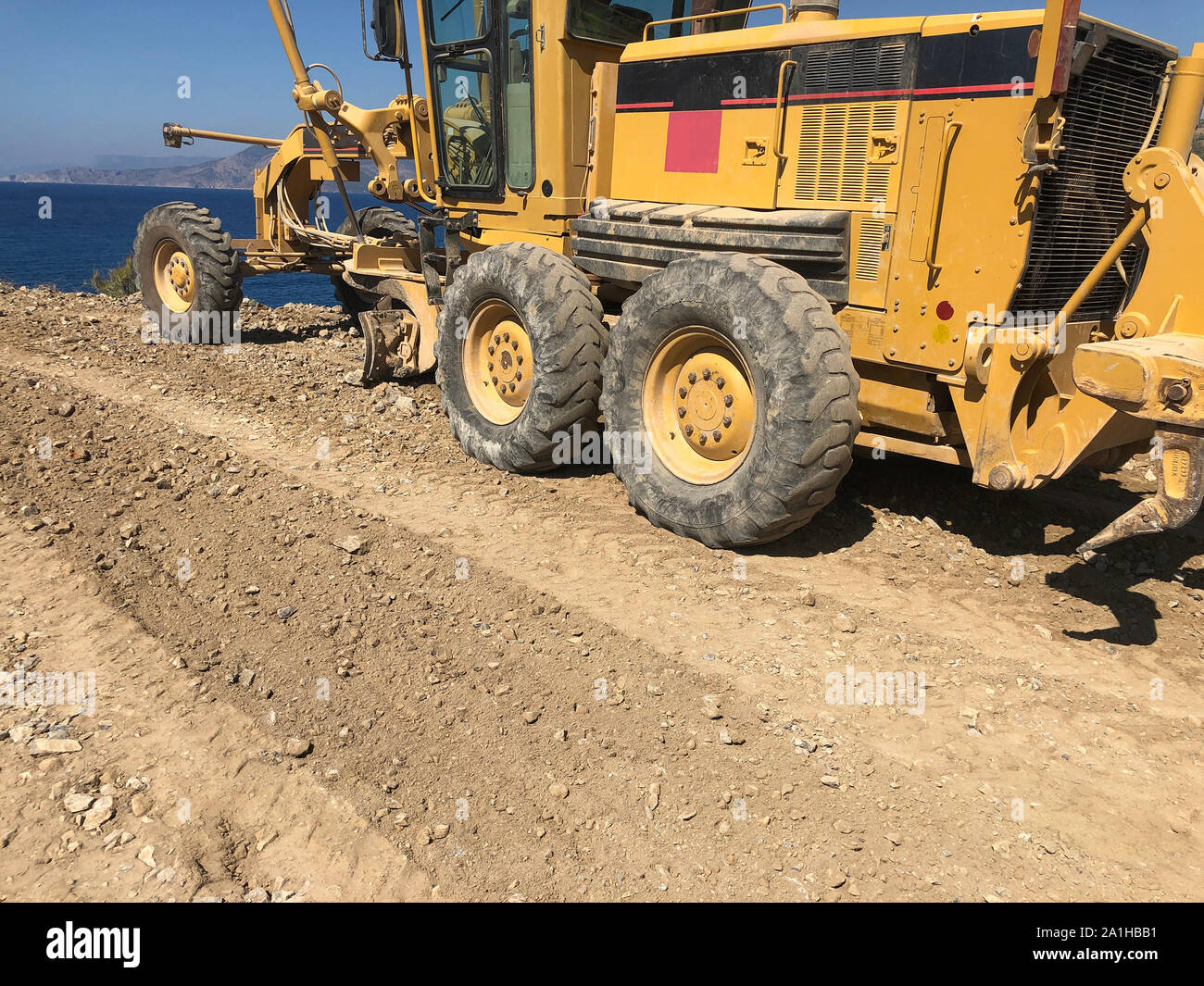 Planning of a road surface. Motor grader during road construction works ...