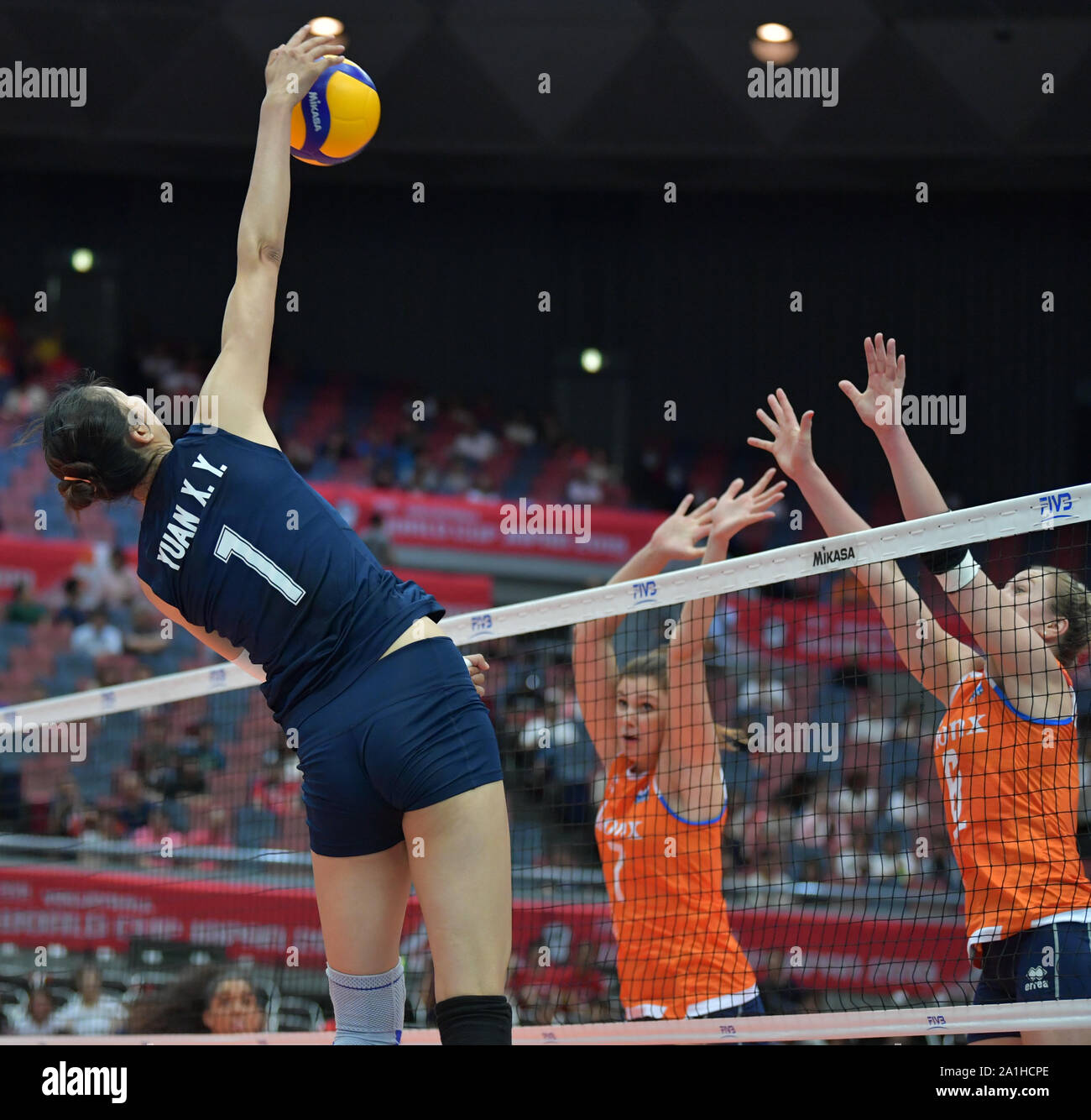 Osaka, Japan. 27th Sep, 2019. Yuan Xinyue (L) of China spikes the ball ...