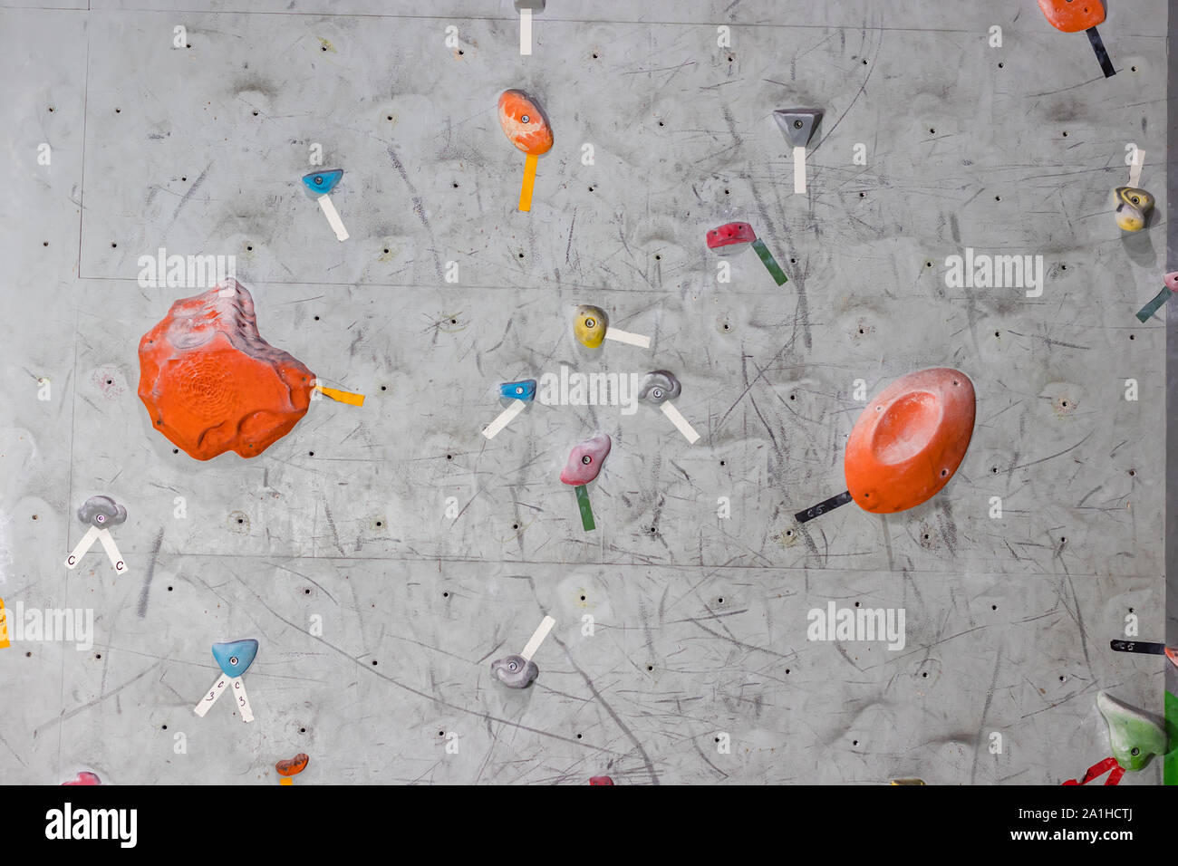 colorful rock climbing wall for grey background Stock Photo - Alamy