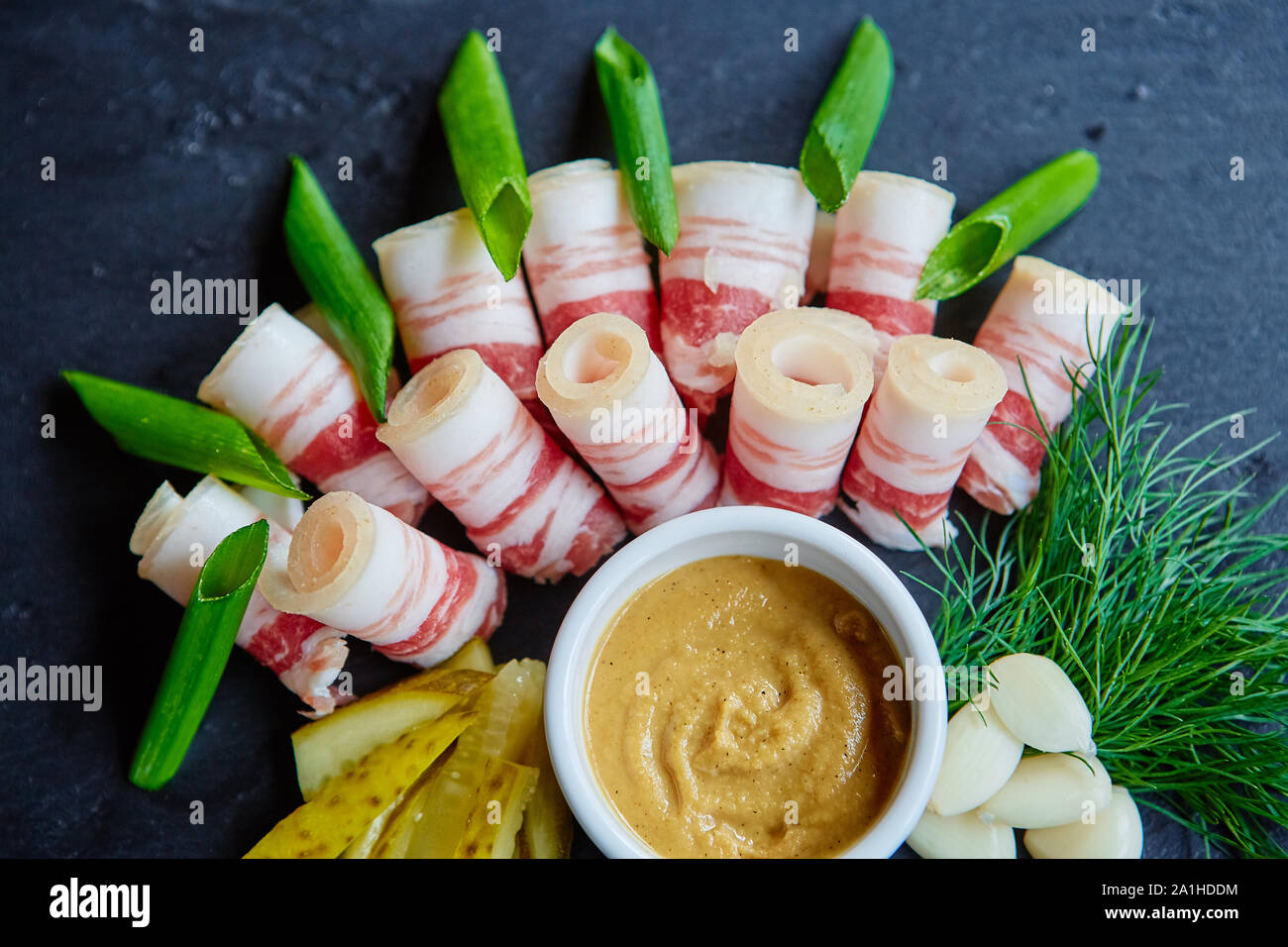 Thin slices of raw salted pork lard with spices, garlic, greens ...