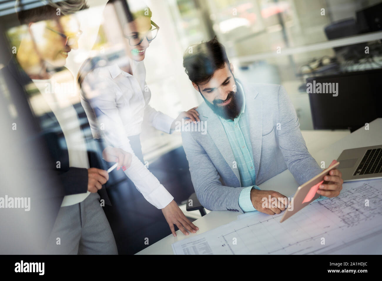Business people working on laptop computer in office Stock Photo - Alamy