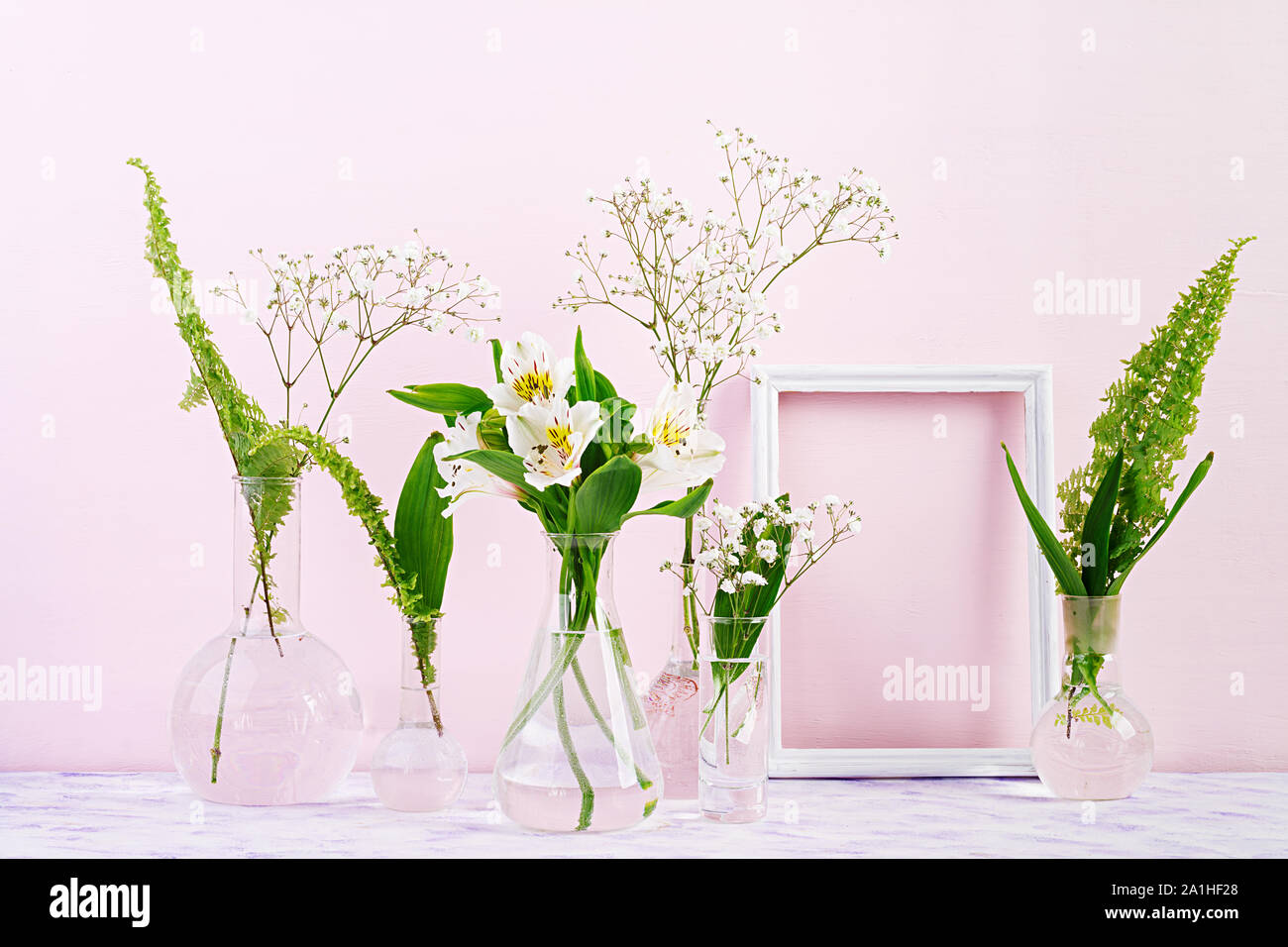 Flowers and plants in flask with frame. Beautiful spring background ...