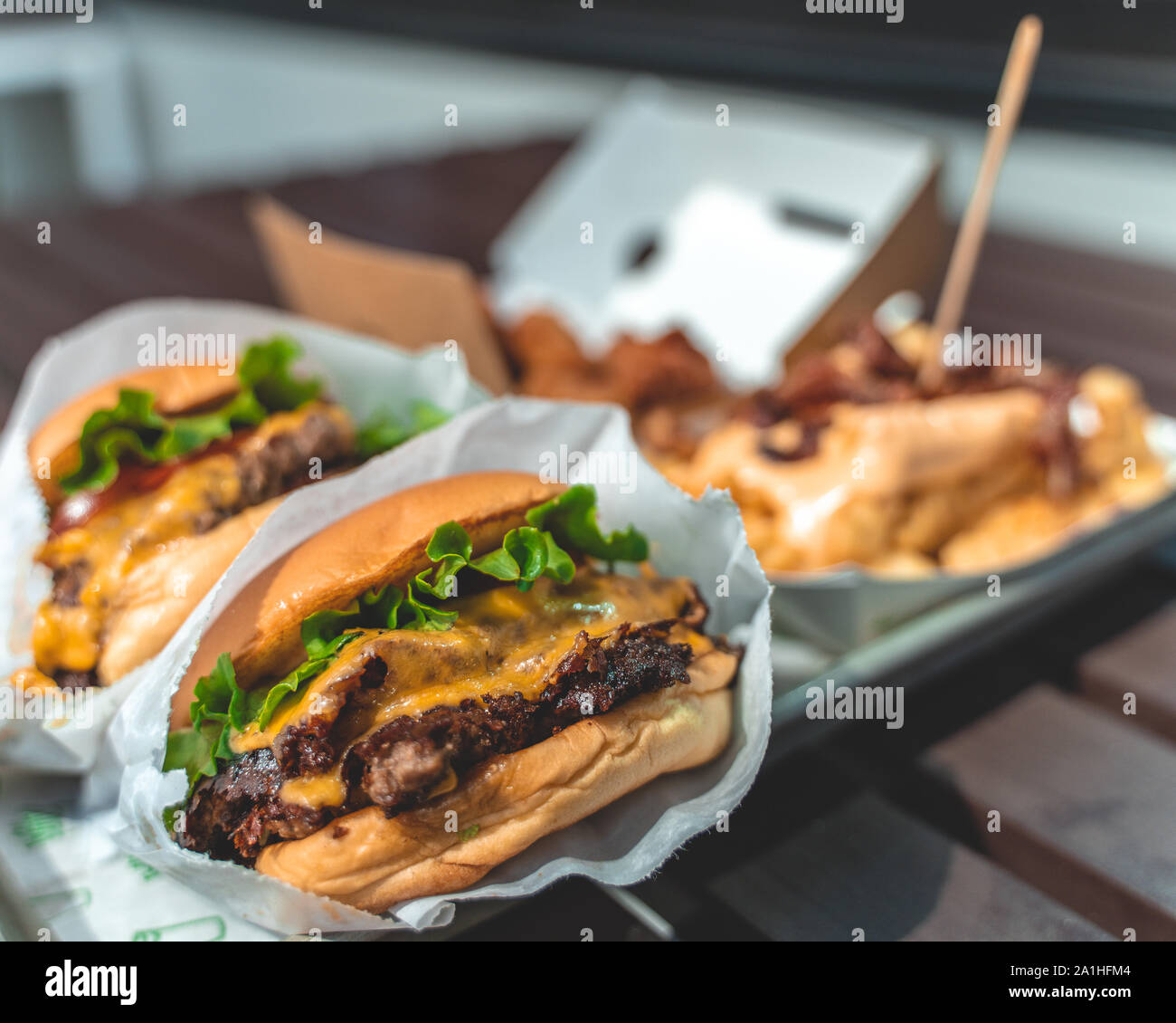 Burgers and fries Stock Photo - Alamy