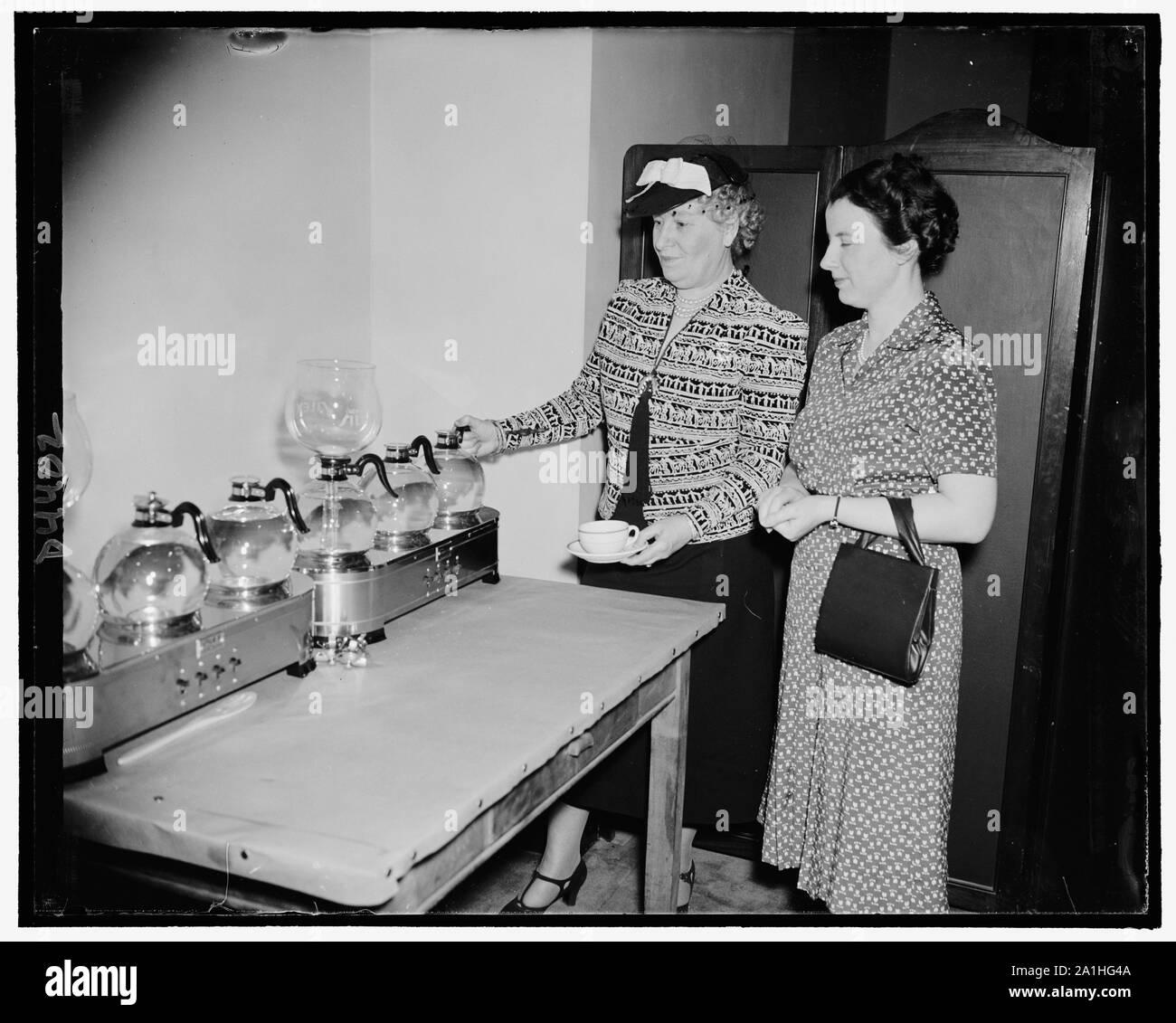Mrs. Warren R. Austin, wife of Senator from Vermont, shows Mrs. Wm ...
