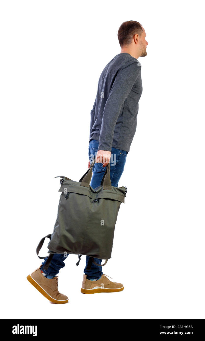 Side view of walking man with green bag. backside view of person. Rear ...