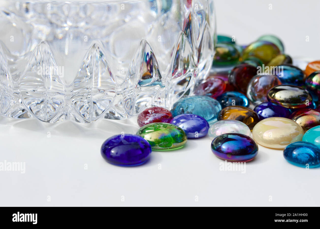 Close up view of a lead crystal bowl surrounded with colorful shiny ...