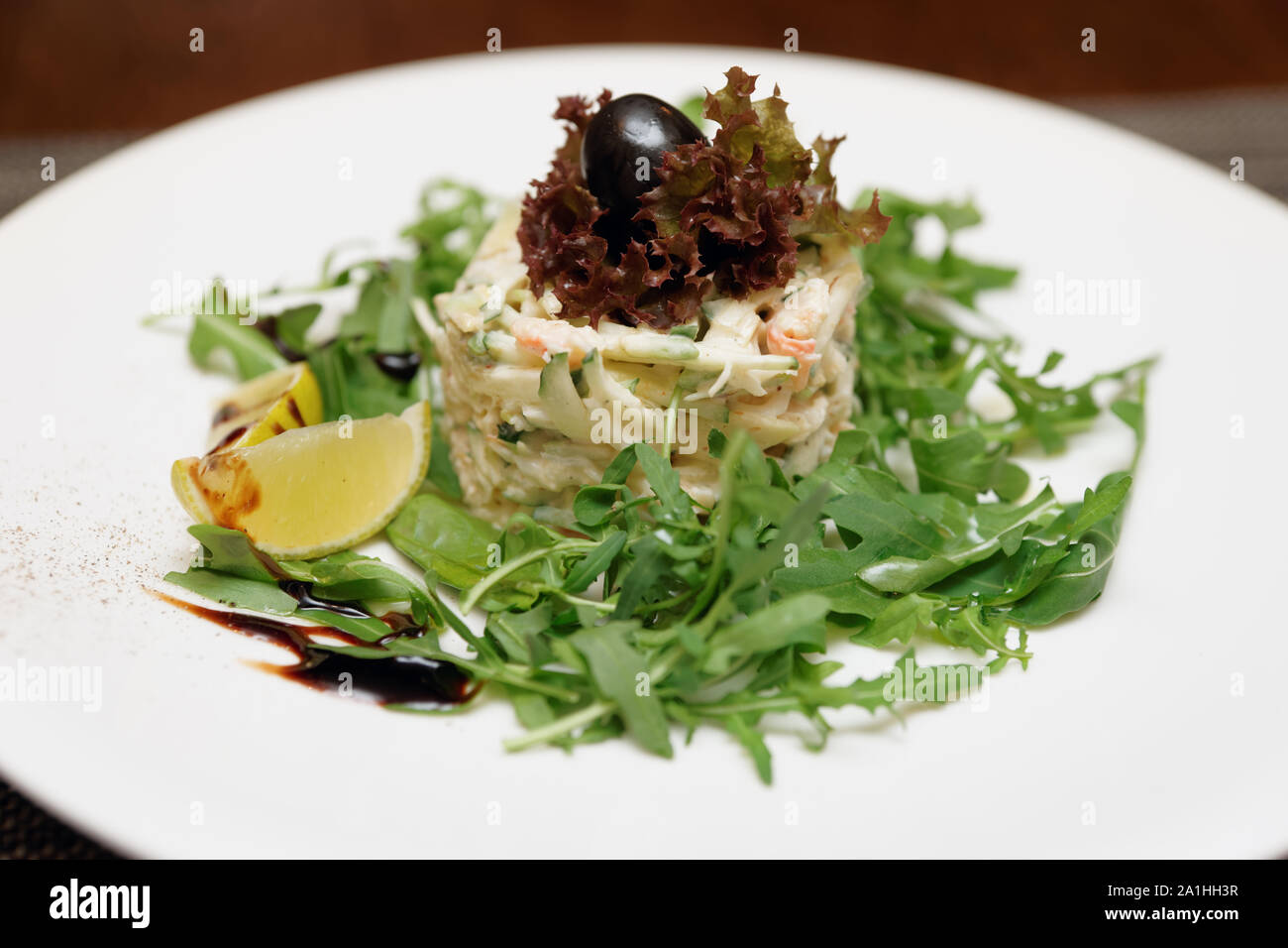 Seafood appetizer with crab and rocket salad Stock Photo - Alamy