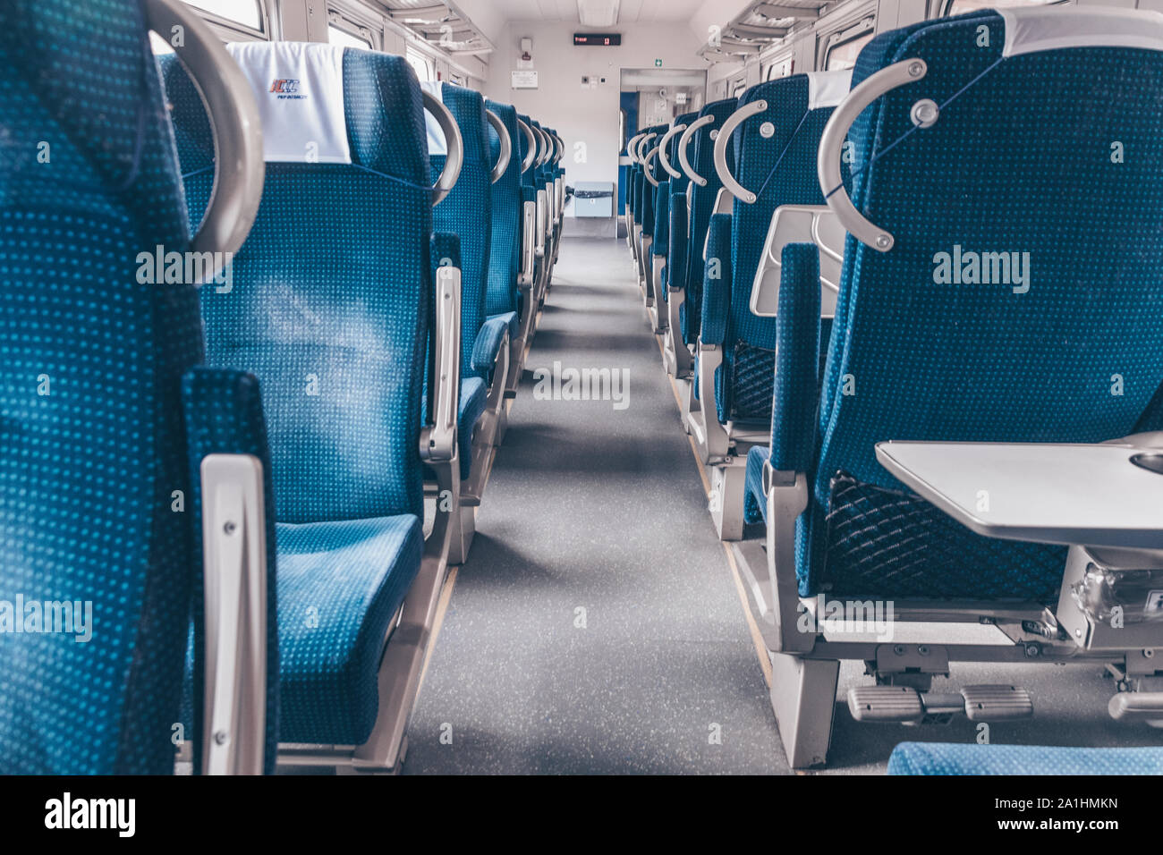 A modern train with comfortable and colorful chairs Stock Photo - Alamy