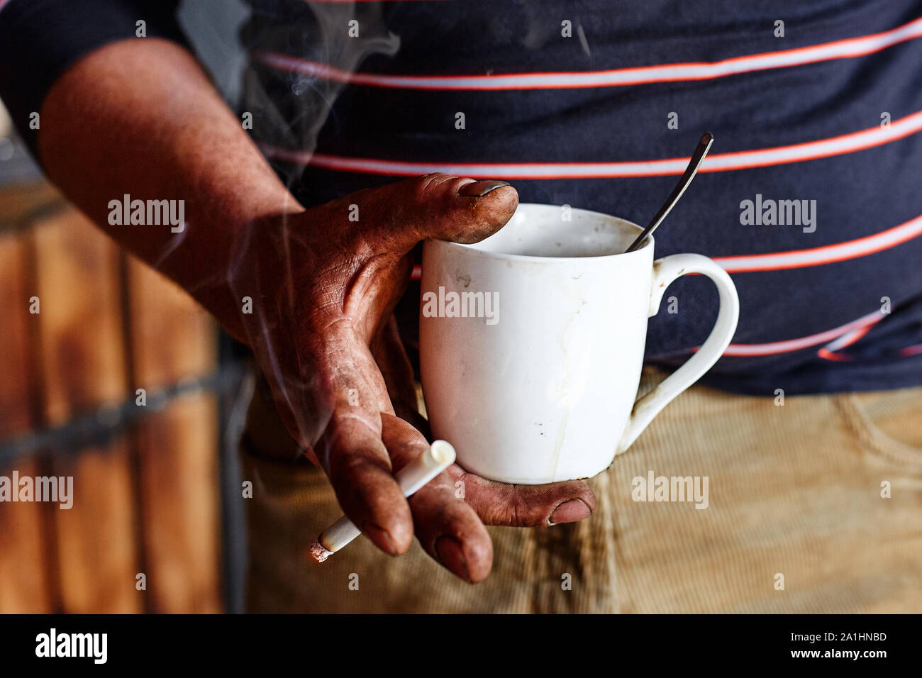 Homeless man smoking cigarette hi-res stock photography and images - Alamy