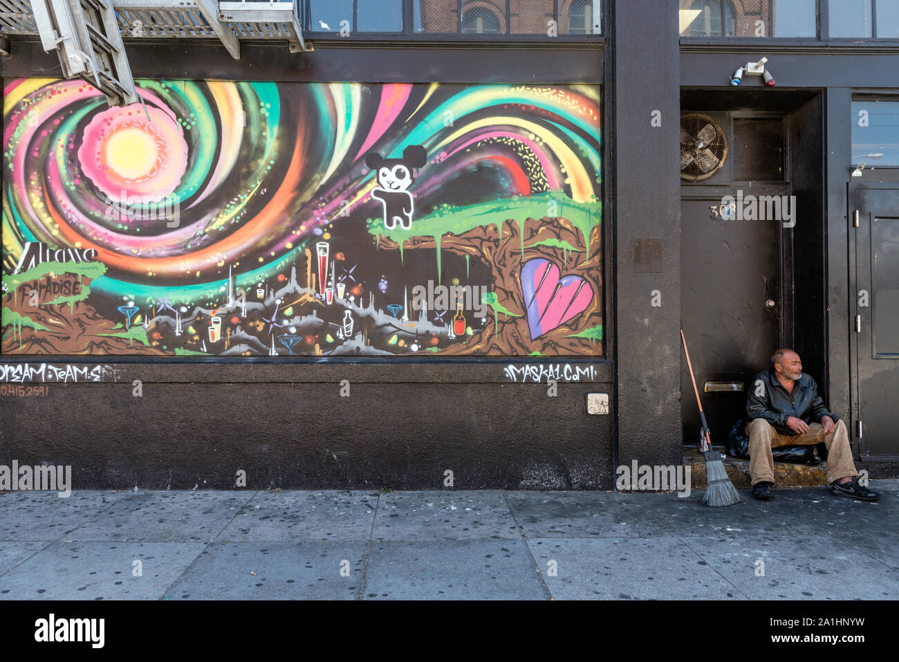 Mural and homeless man in San Francisco Mission District Stock Photo ...