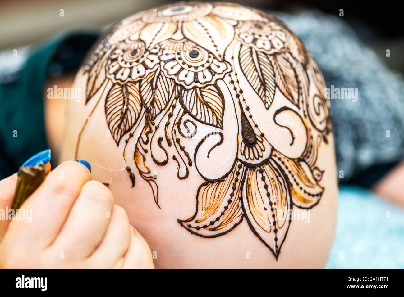 Drawing process of henna mehndi tattoo on womans bald head Stock Photo ...