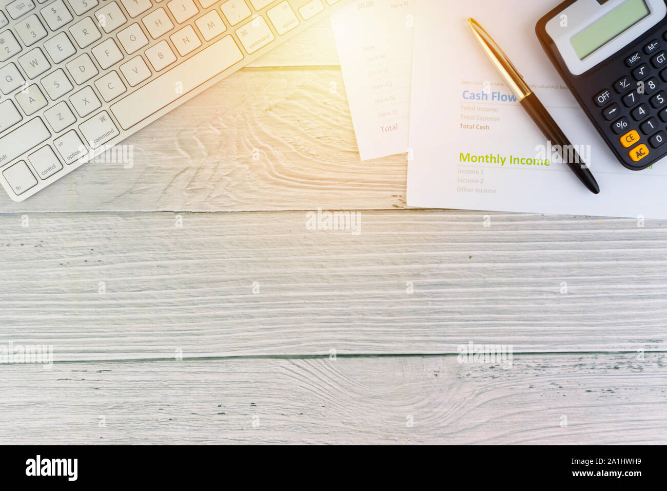 Flat lay view of office workspace with keyboard, pen, paperwork on ...