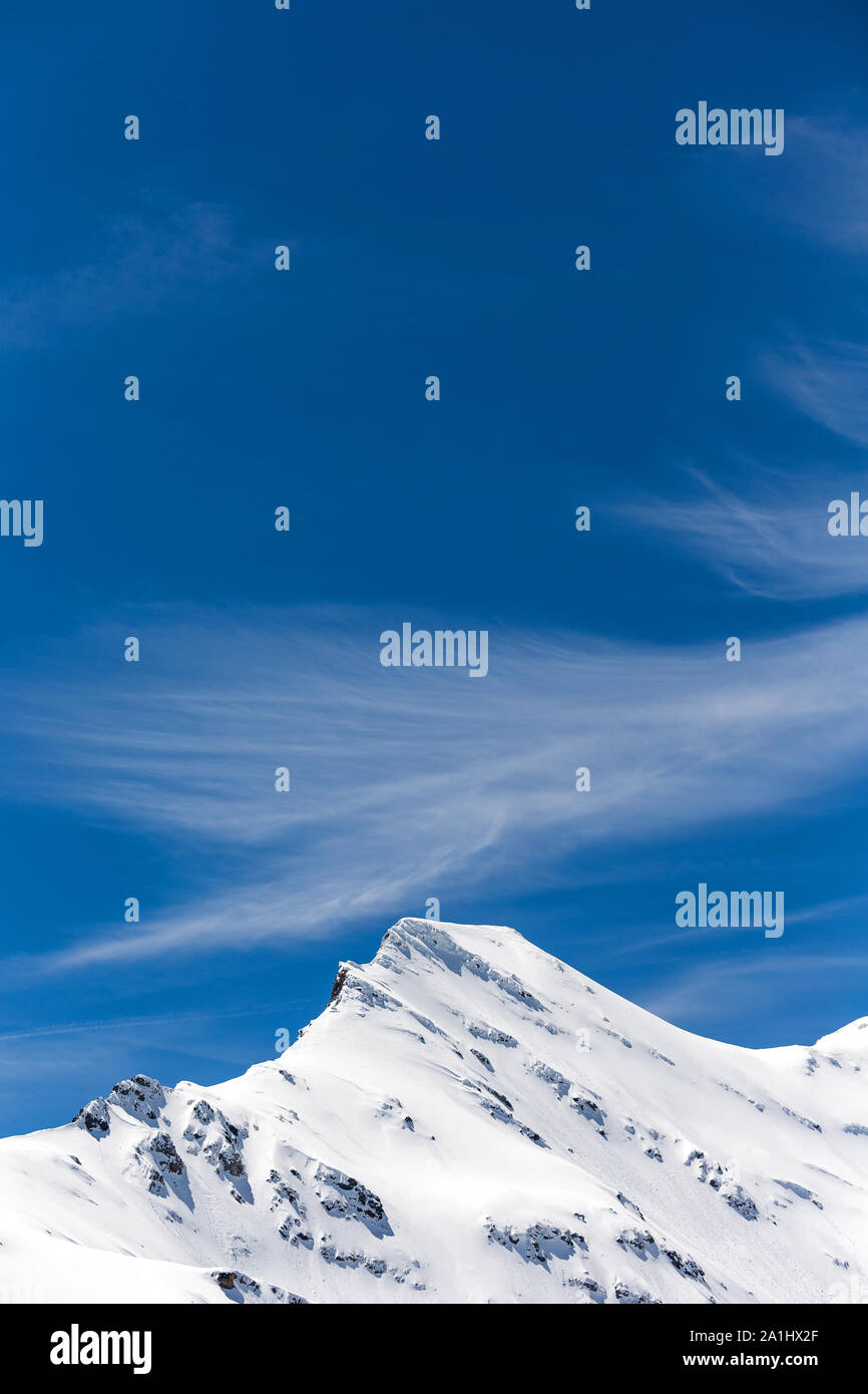 Spring snow and trees on the slope. Grossglockner Pass in Austria ...