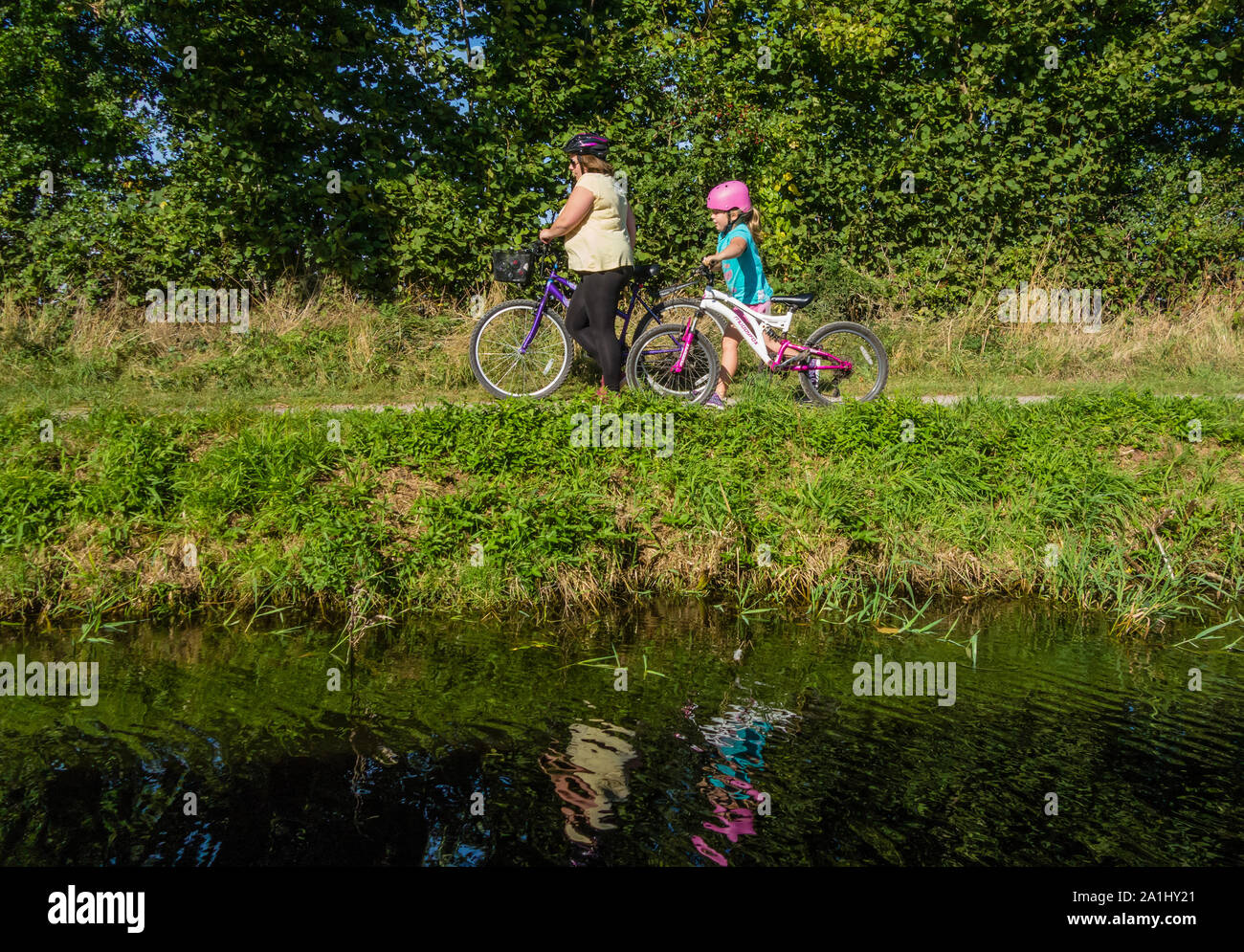 Mother and Child cycling on Grand Western Canal Towpath, Devon, England ...