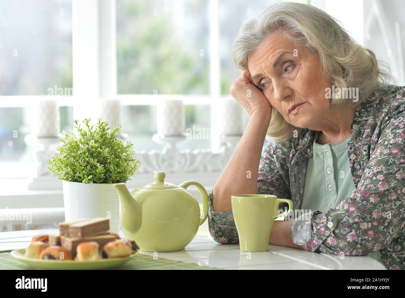 Sad adult woman drinking tea hi-res stock photography and images - Alamy