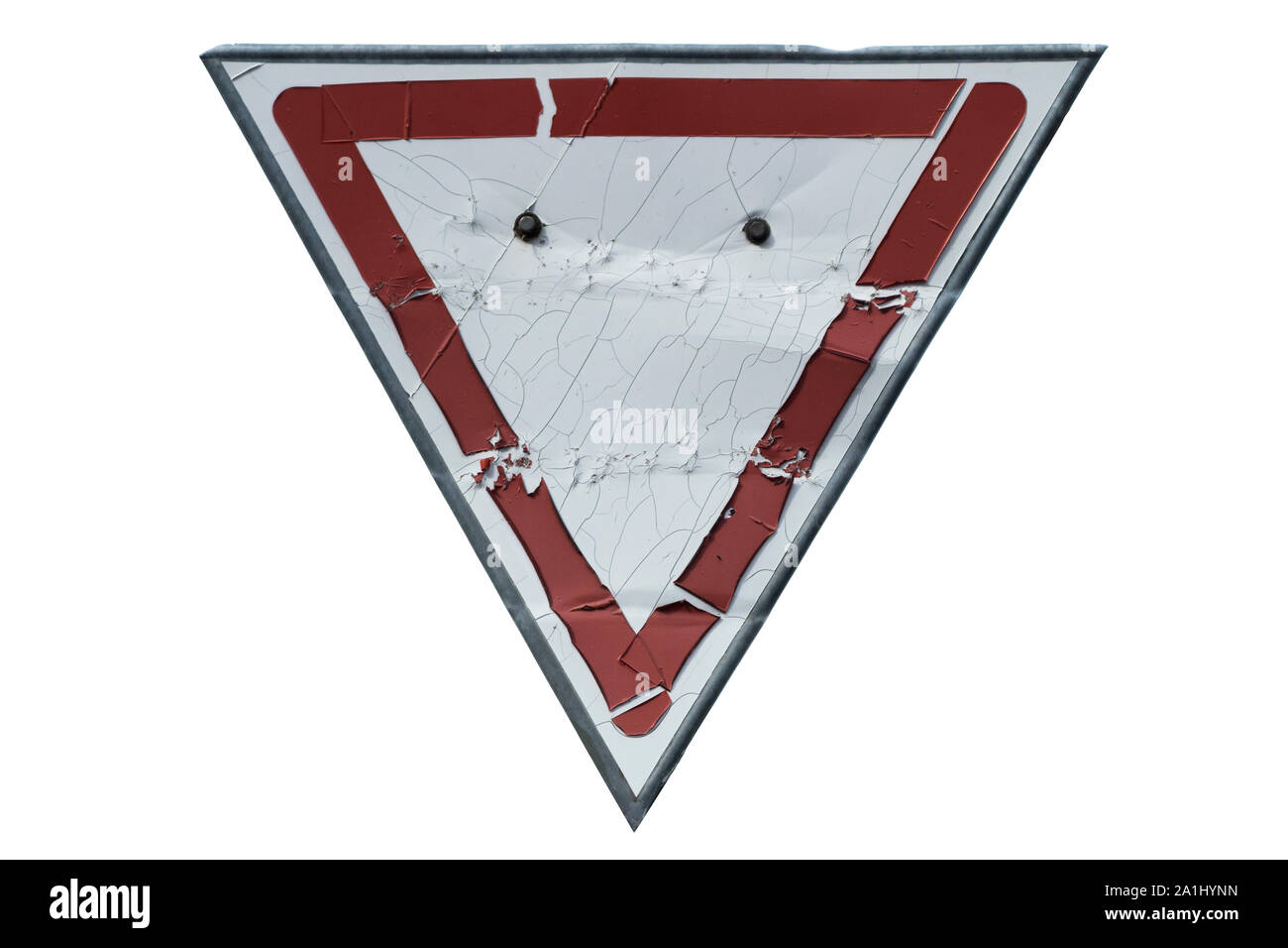 Triangular old rusty weather-stained road sign 'Yield' ('Give way ...