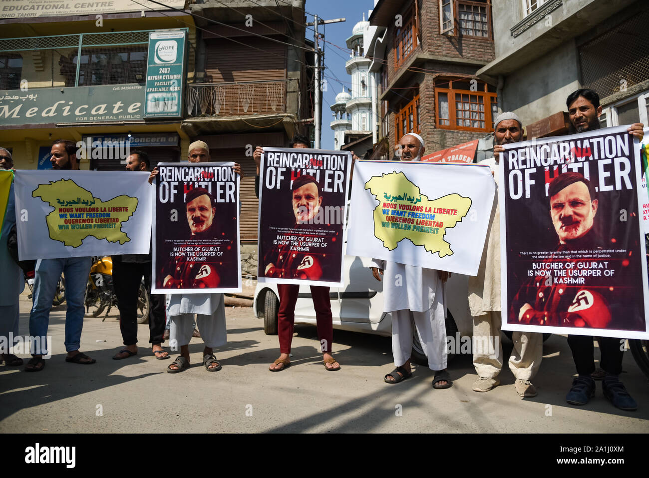 Protesters hold placards during the restrictions in Srinagar.After the ...