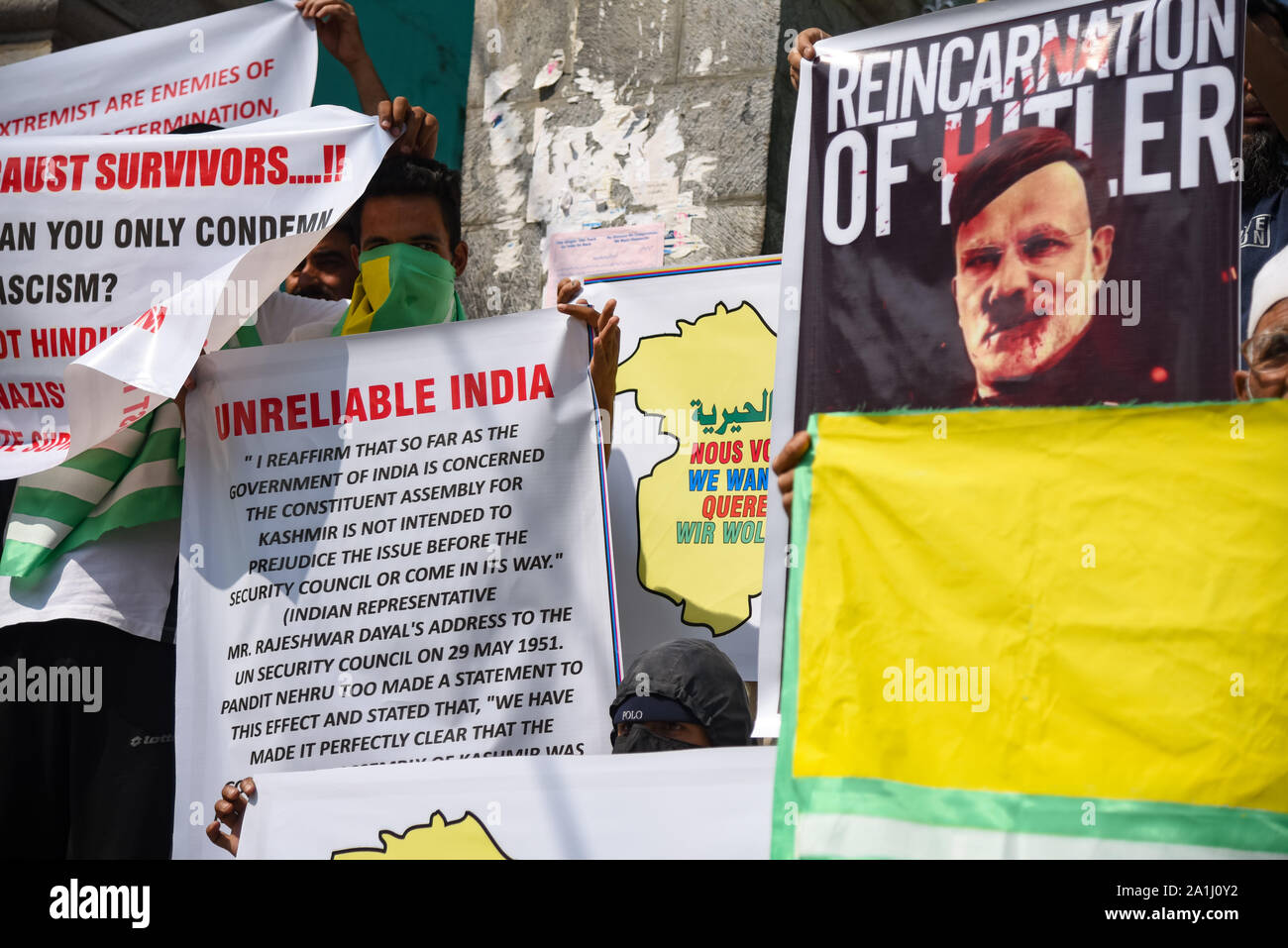 Protesters hold placards during the restrictions in Srinagar.After the ...