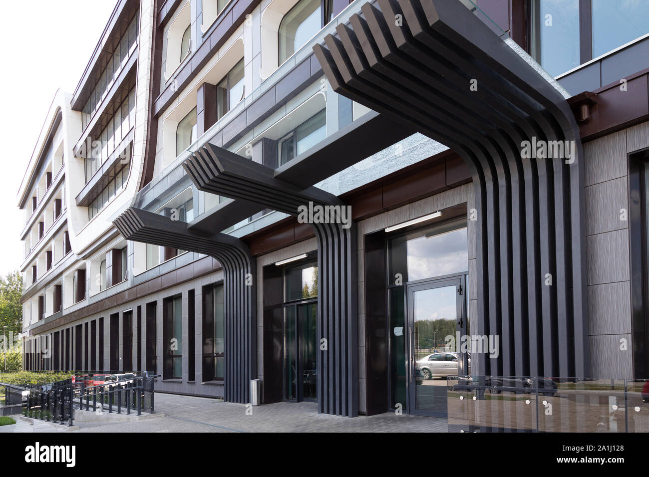 Diagonal angle view of modern building with beige and brown tiled walls ...