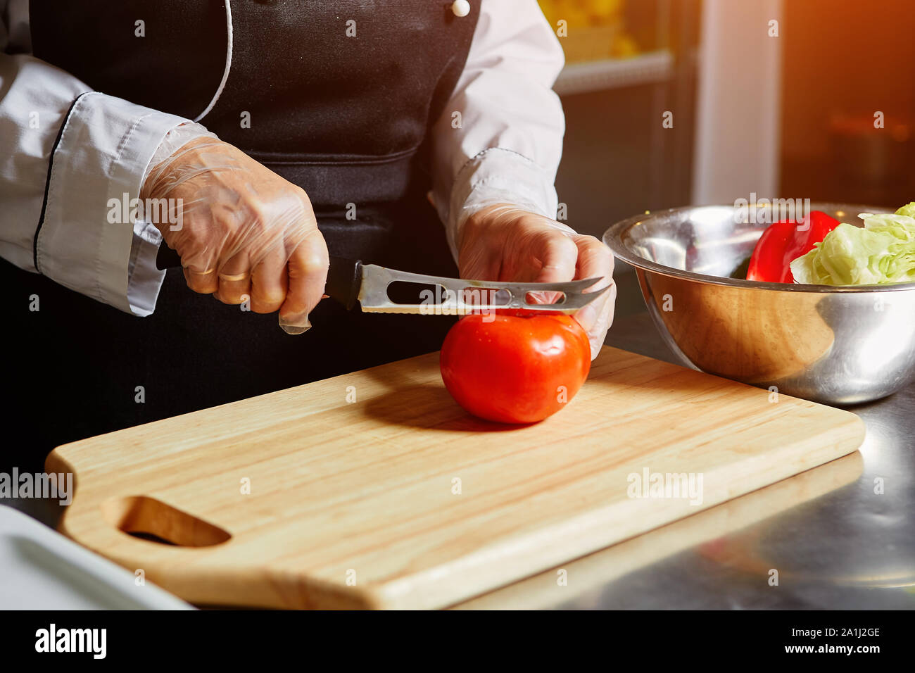 Professional chef chopping tomato hi-res stock photography and images ...