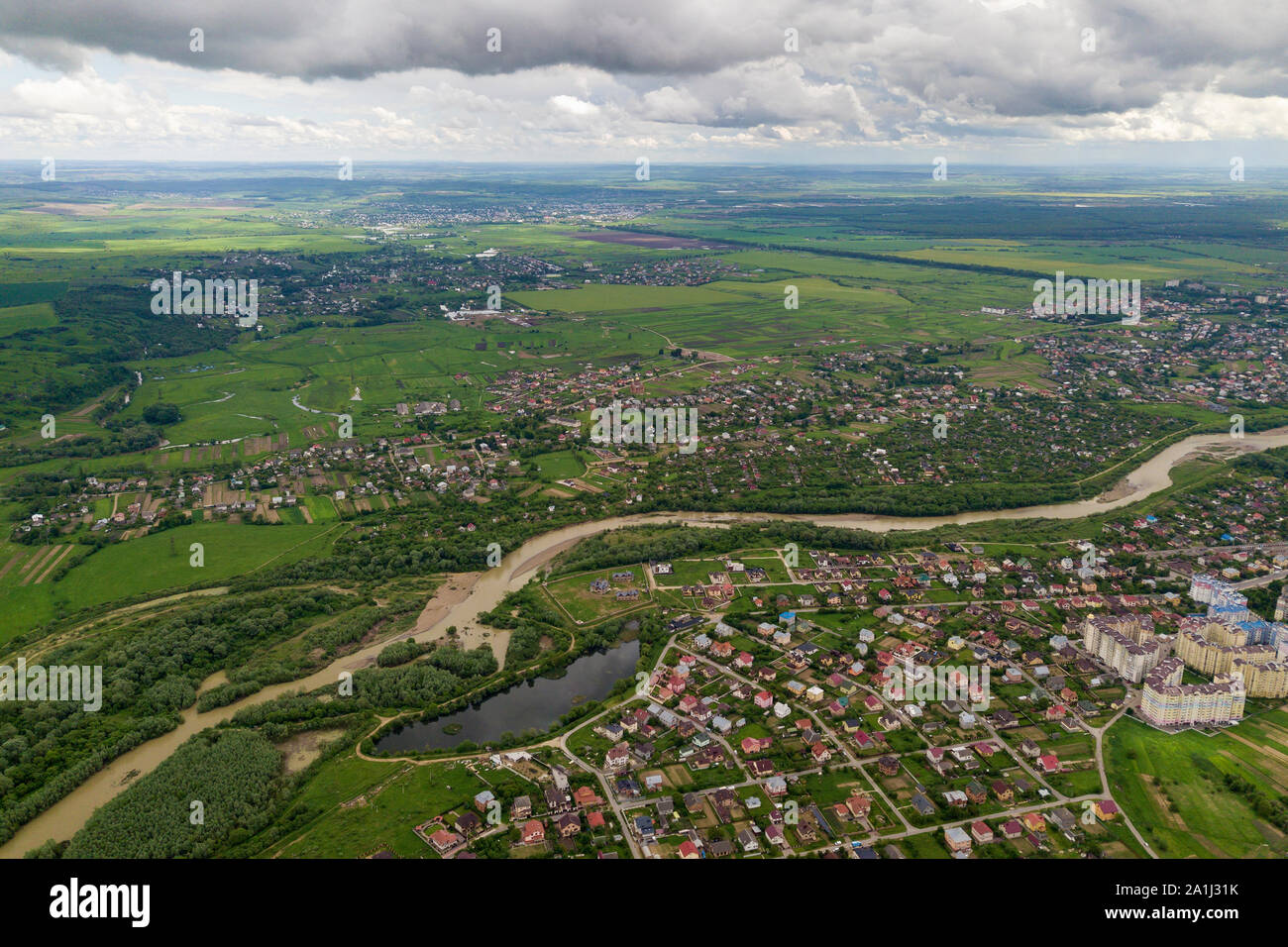 Top down aerial view of town or village with rows of buildings and ...