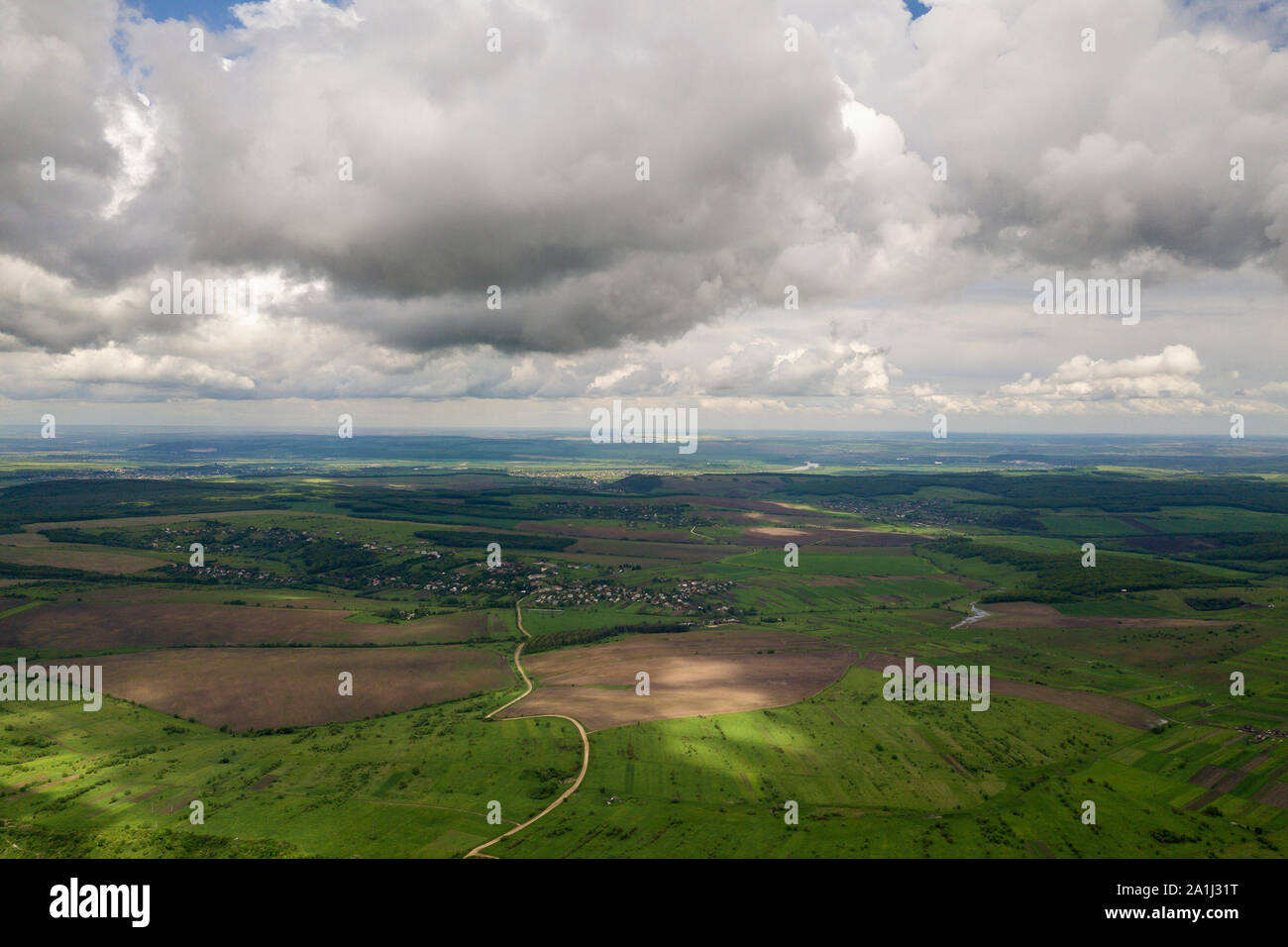 Top down aerial view of town or village with rows of buildings and ...