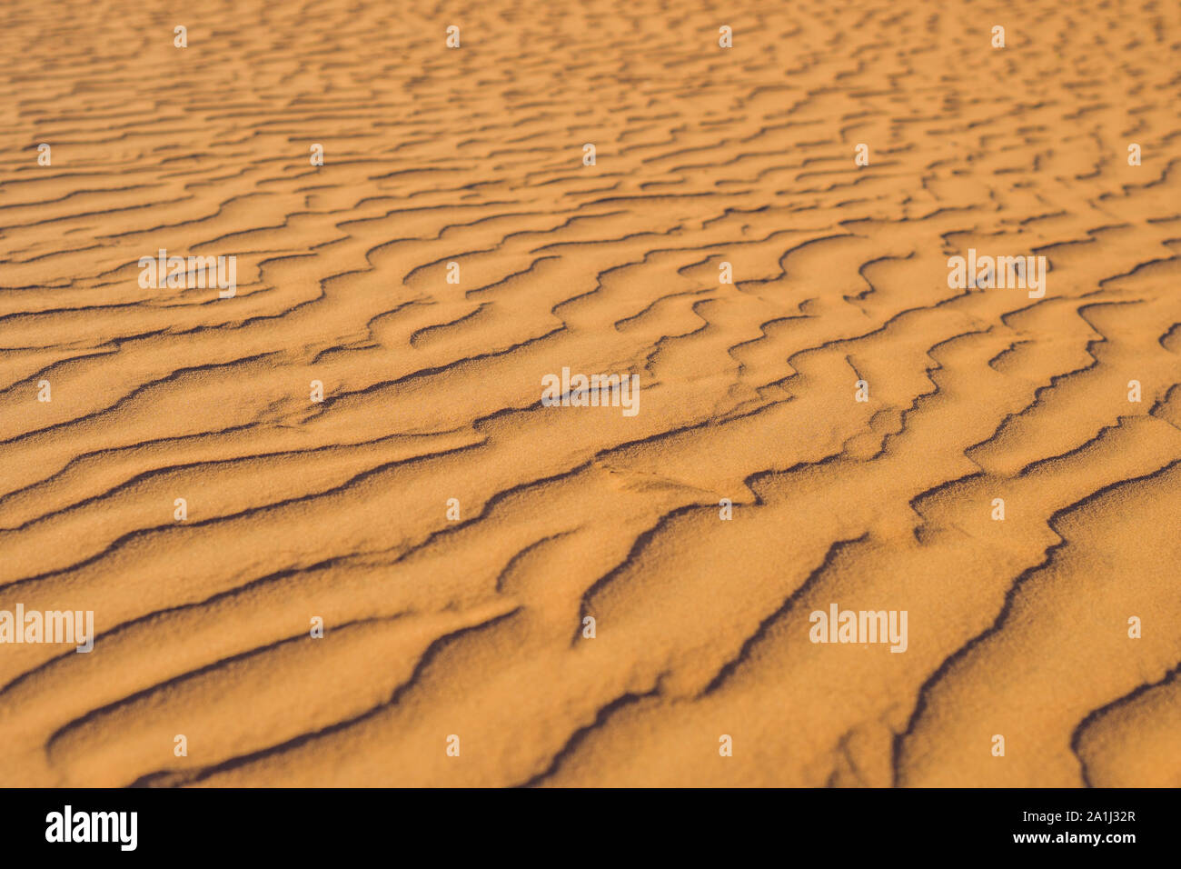 Sand with waves in the red desert Stock Photo - Alamy
