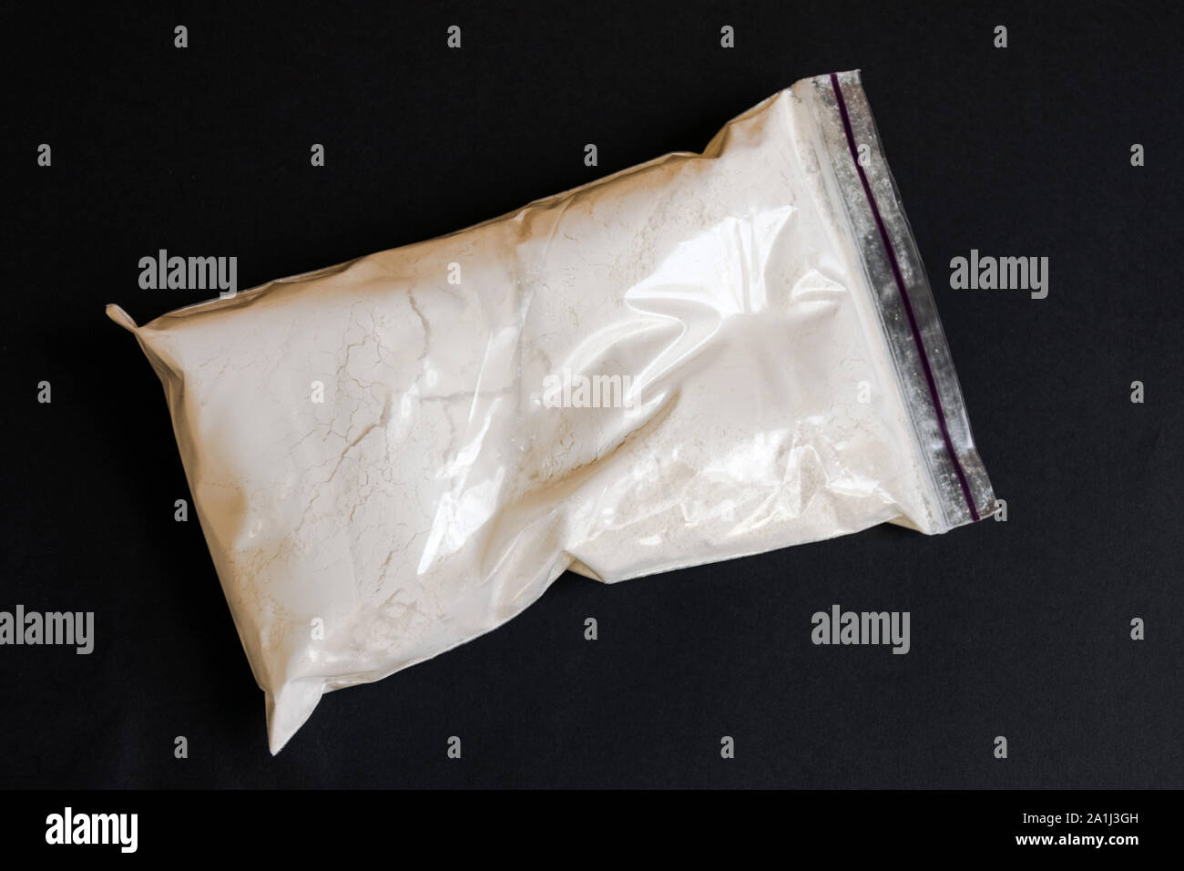 Drugs in a plastic bag on black background. Narcotic drugs addicted ...