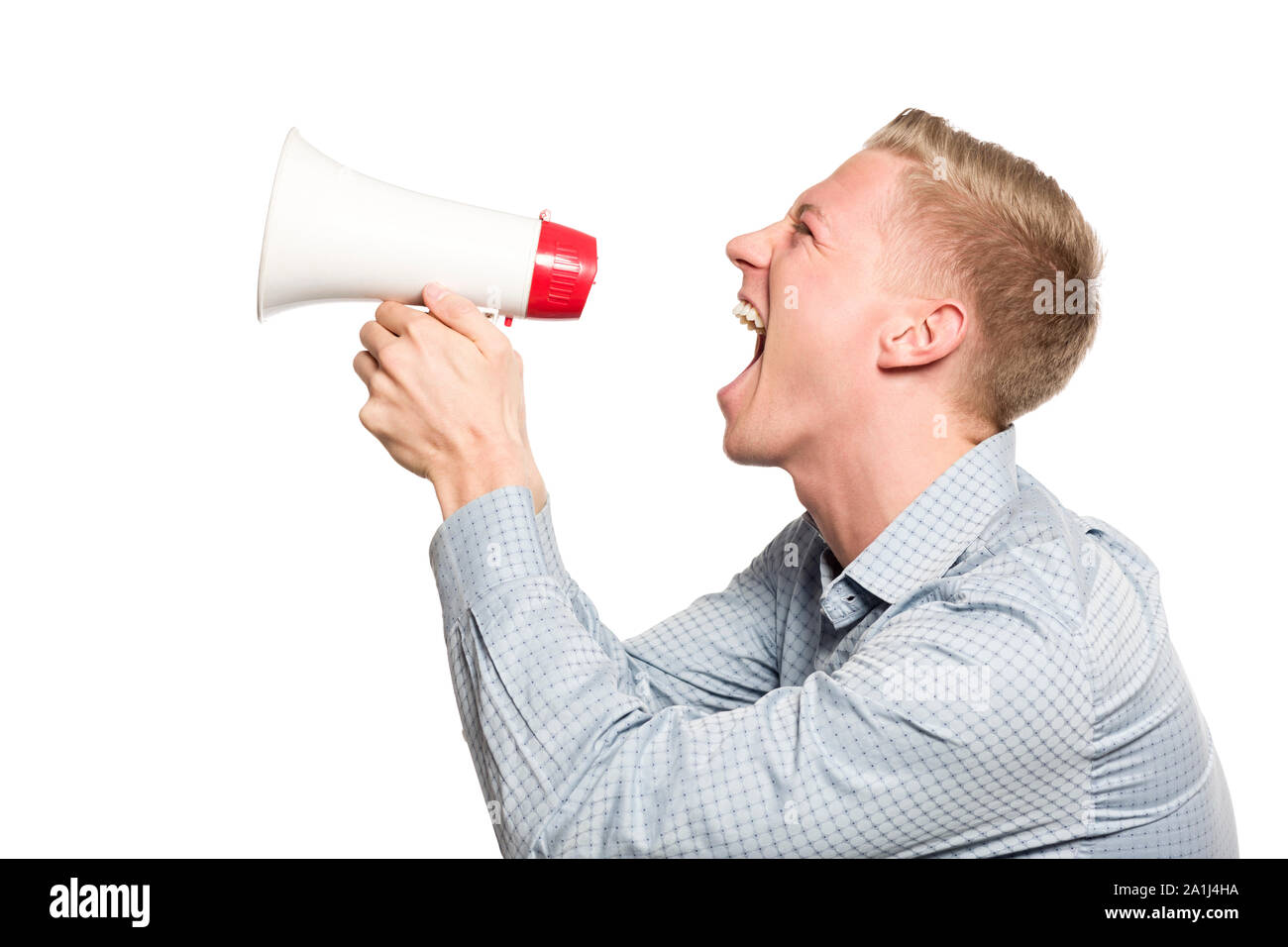 Furious businessman shouting with megaphone Stock Photo - Alamy
