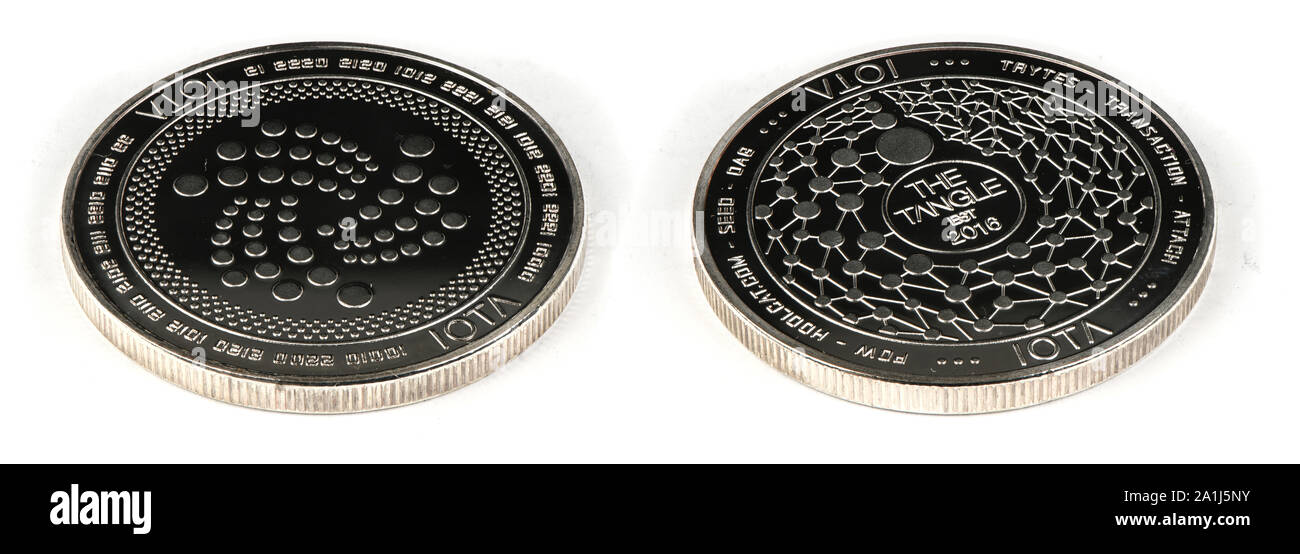 Face and back side of the crypto currency silver iota isolated on white ...