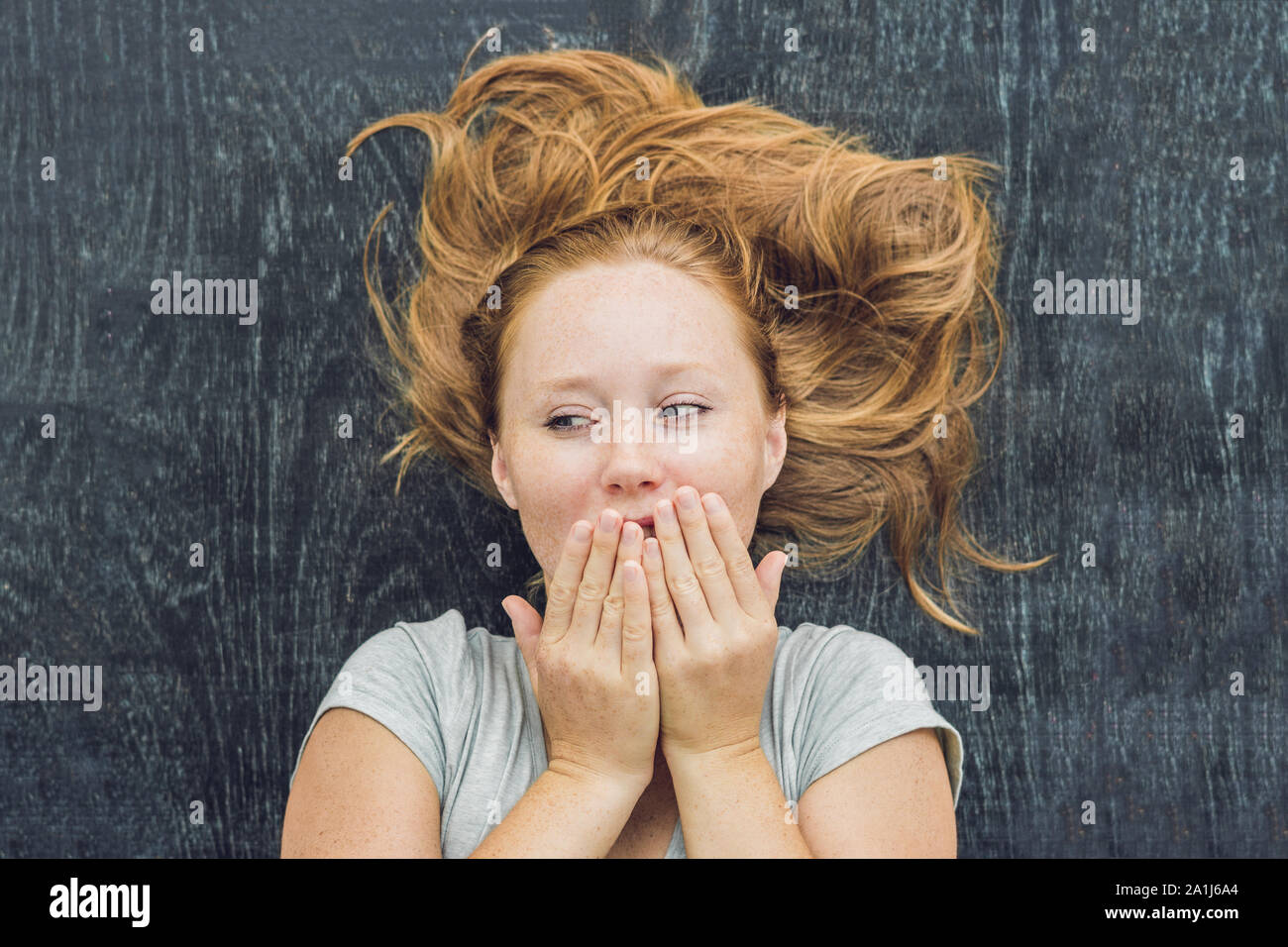 Top view of a young woman with space for text and symbols on the old ...