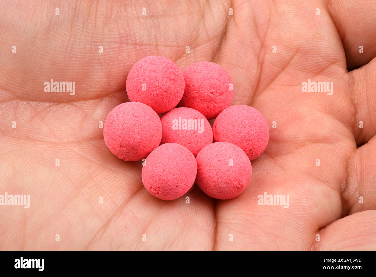 Hand holds boilies, fishing baits for carp. High resolution photo. Full ...