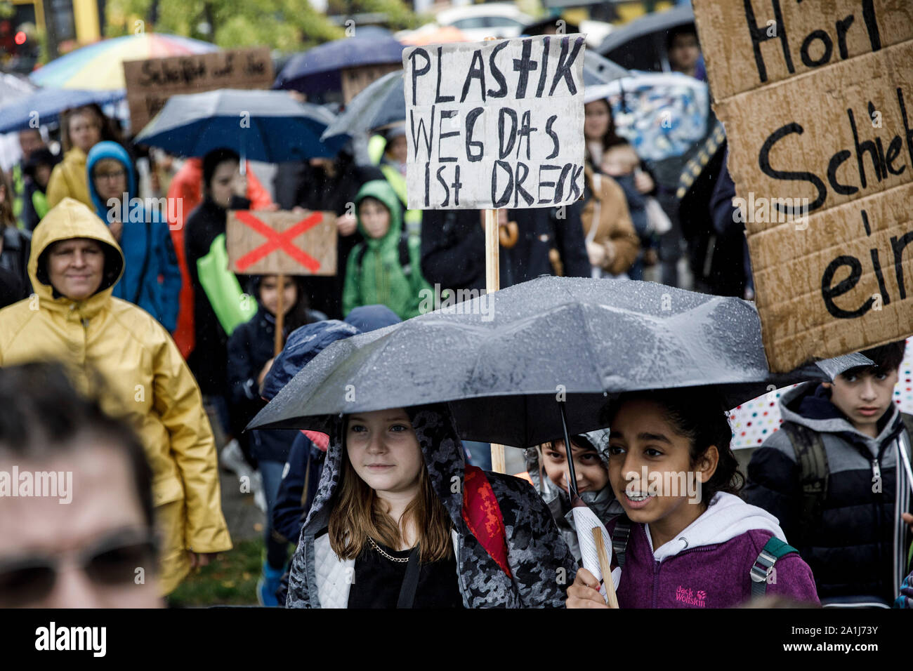 Berlin, Germany. 27th Sep, 2019. Demonstrators hold signs with slogans ...