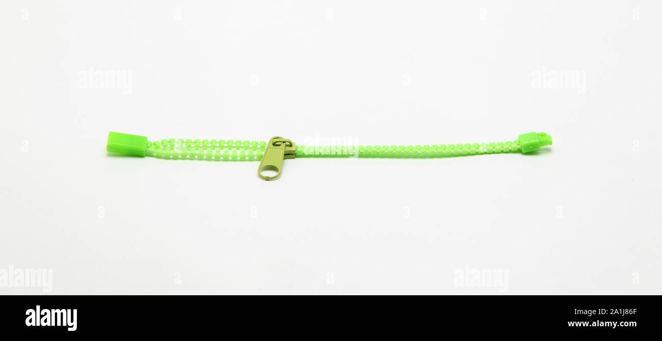 green zipper isolated on white Stock Photo - Alamy