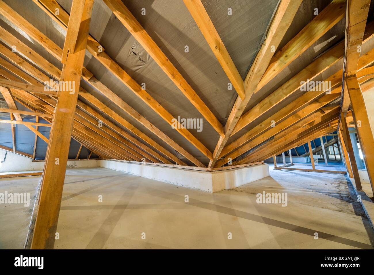 Attic of a building with wooden beams of a roof structure Stock Photo ...