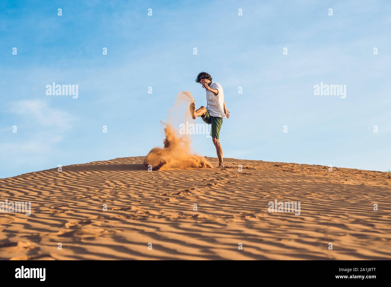 Kicking sand in face hi-res stock photography and images - Alamy