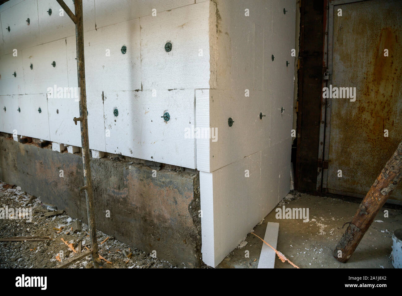 Insulation work of house walls with styrofoam sheets Stock Photo - Alamy