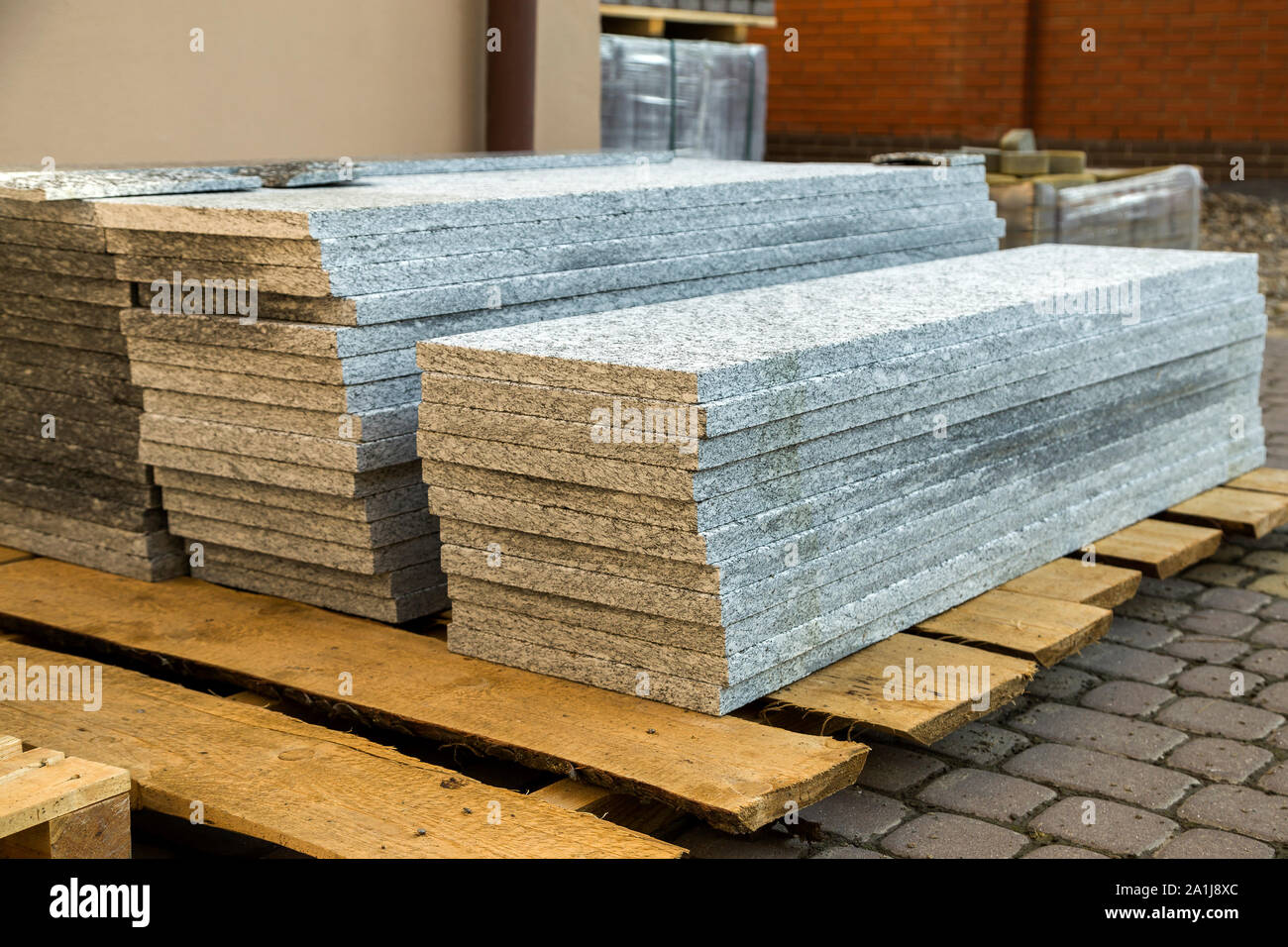 Piles of granite marble slabs. Stone sheets for decorative construction ...