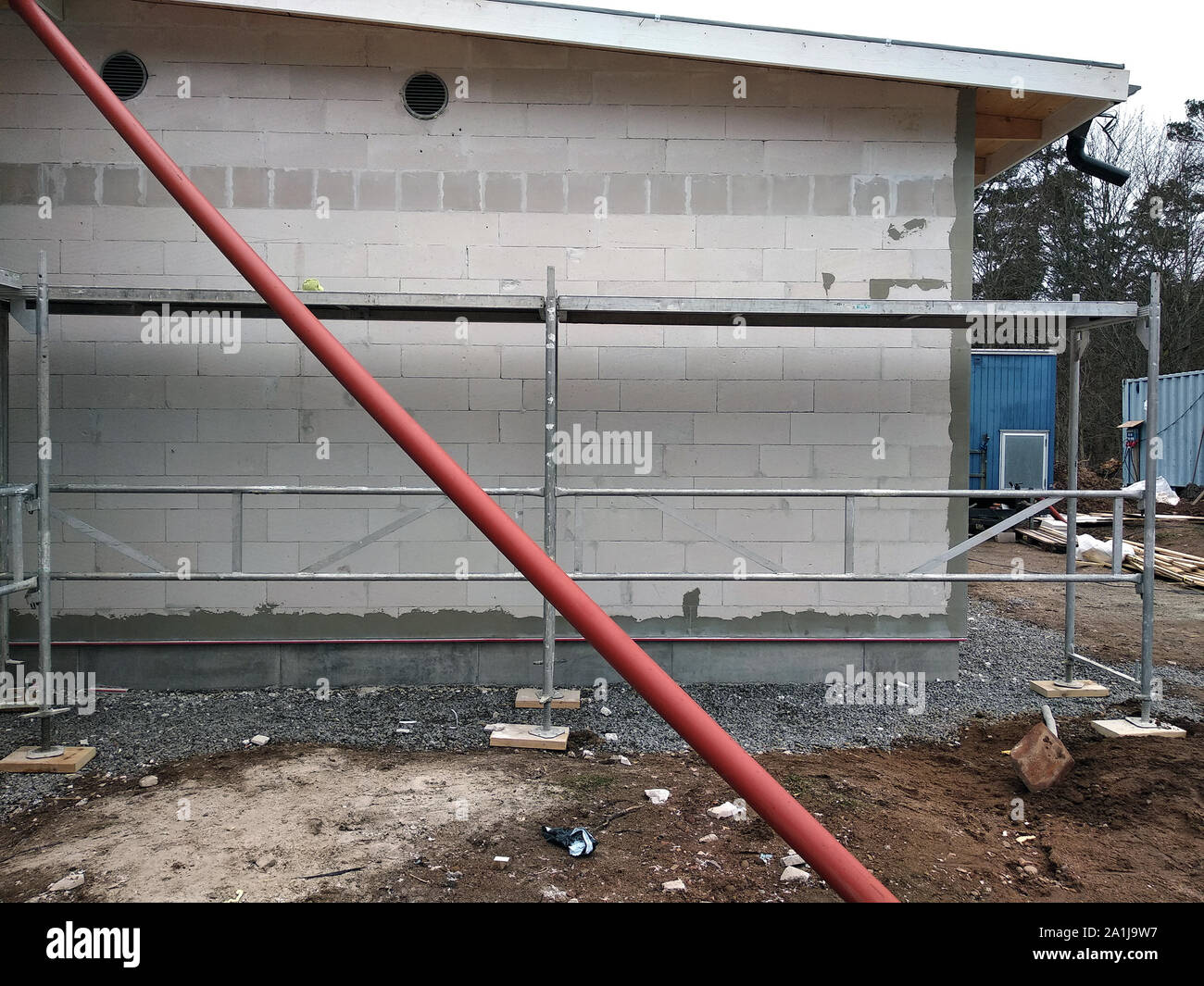 Facade of white block building under construction works Stock Photo - Alamy