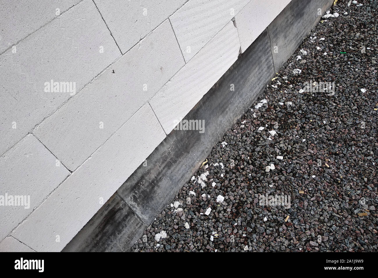 Facade of white block building under construction works Stock Photo - Alamy